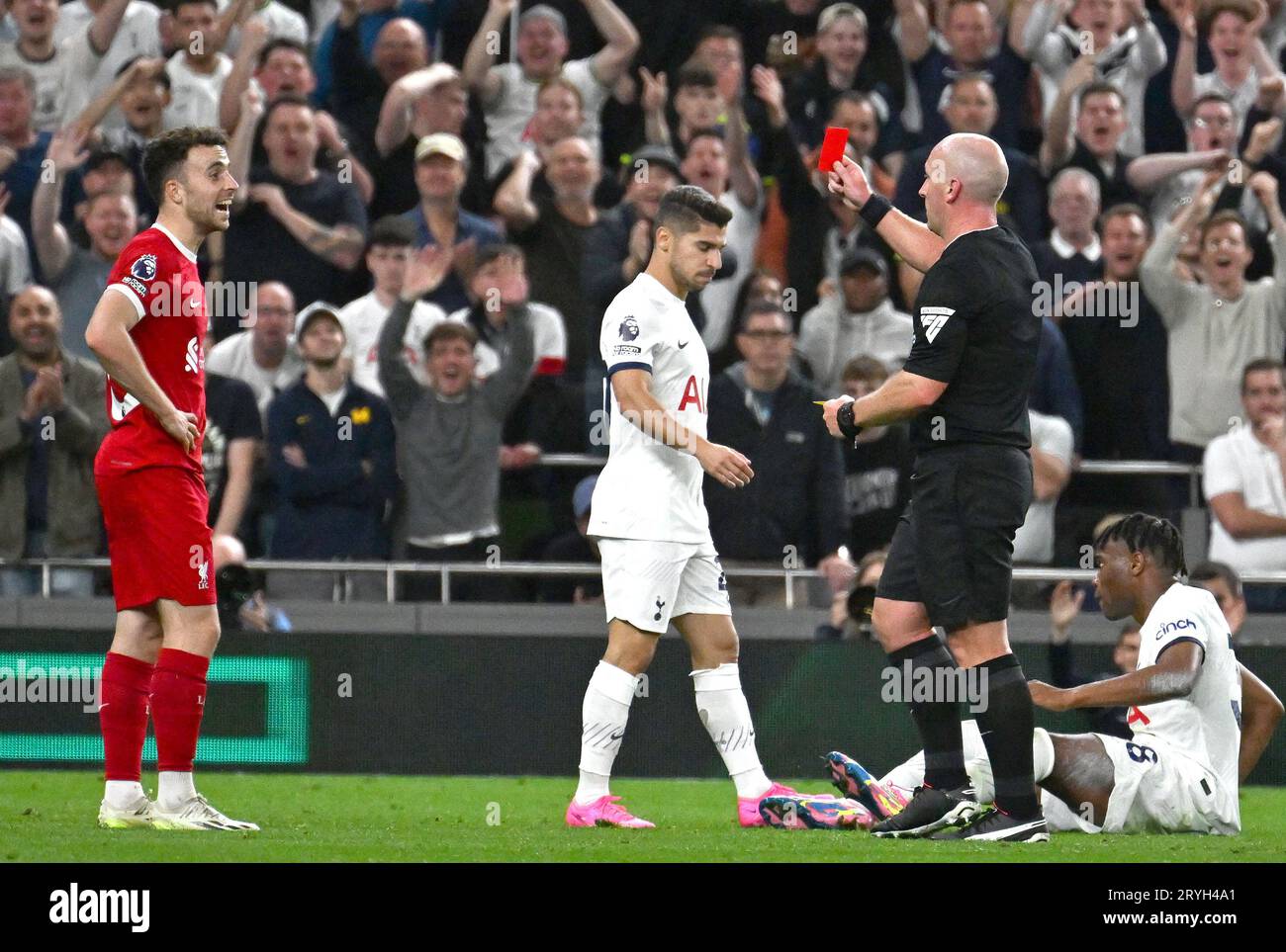 London, UK. 30th Sep, 2023. Referee Simon Hooper shows a red card and ...