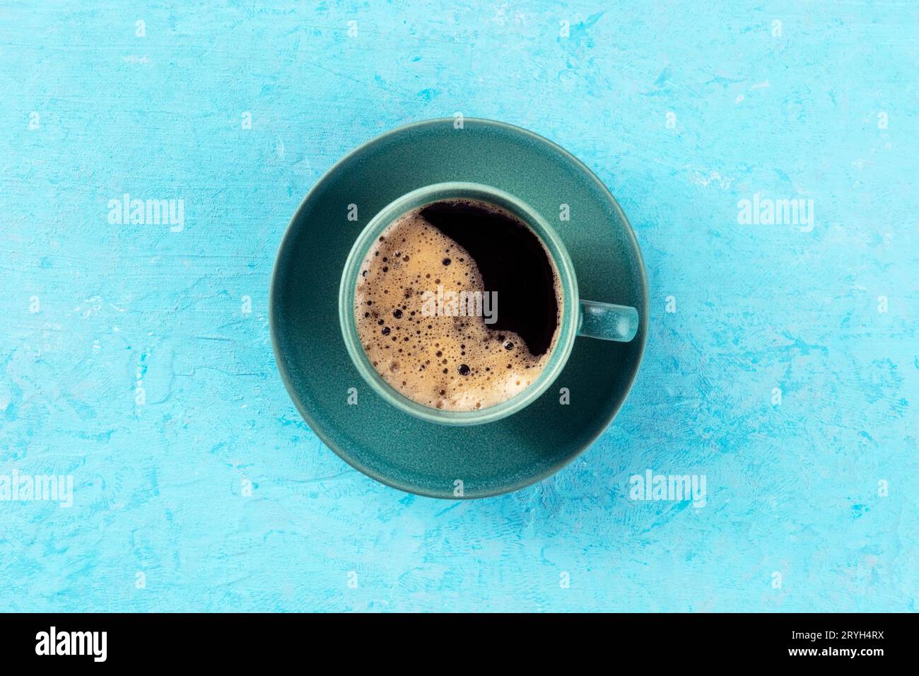 Coffee cup, overhead flat lay shot on a blue background, espresso drink ...