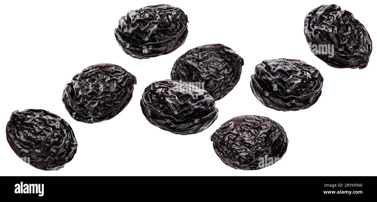 Falling prunes isolated on white background Stock Photo - Alamy