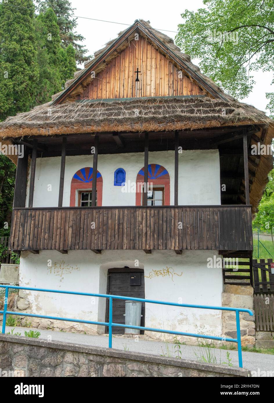 Stone house with straw roof. Preserved building built using traditional ...