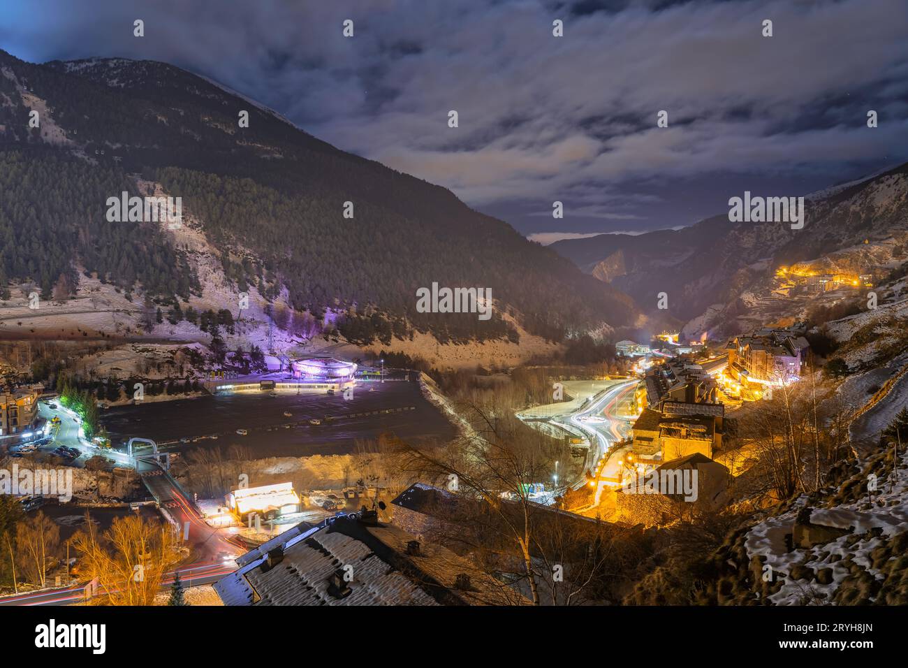 El Tarter town. Resorts and ski lifts illuminated by street lights at ...