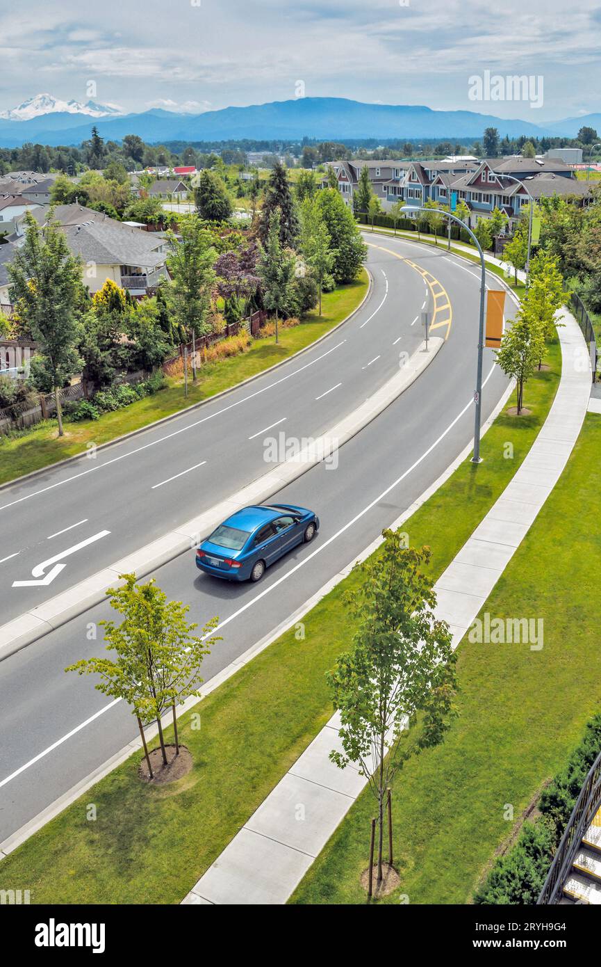 Asphalt road through suburban hi-res stock photography and images - Alamy