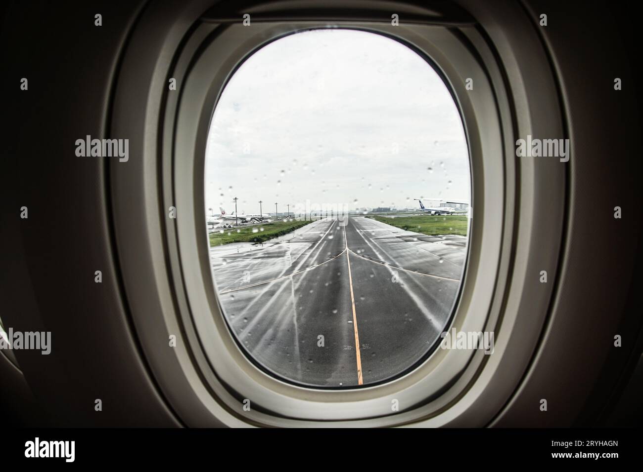 Runway which is visible from the window of an airplane Stock Photo - Alamy