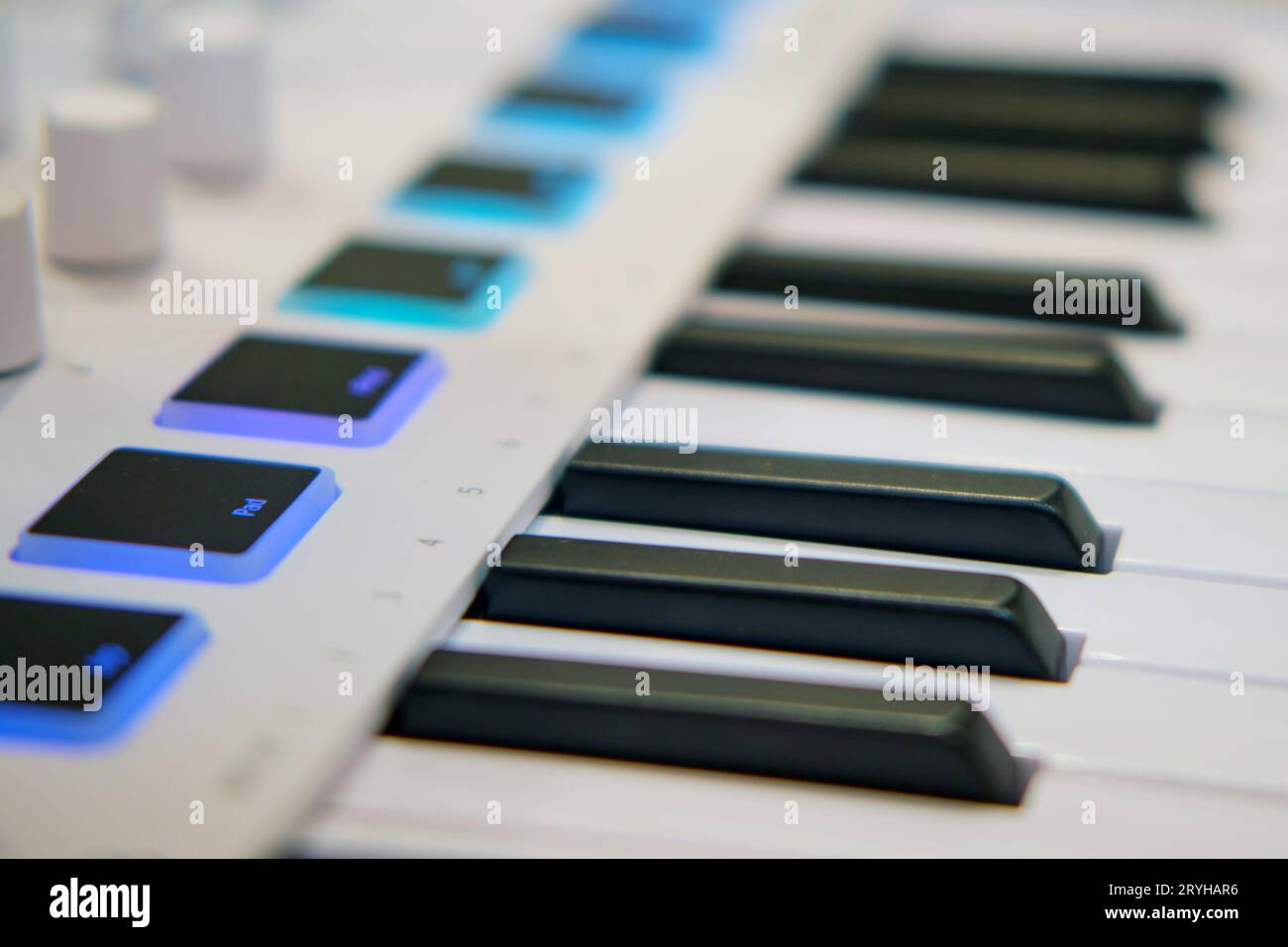 Close up of an electronic piano keyboard with blue buttons Stock Photo ...