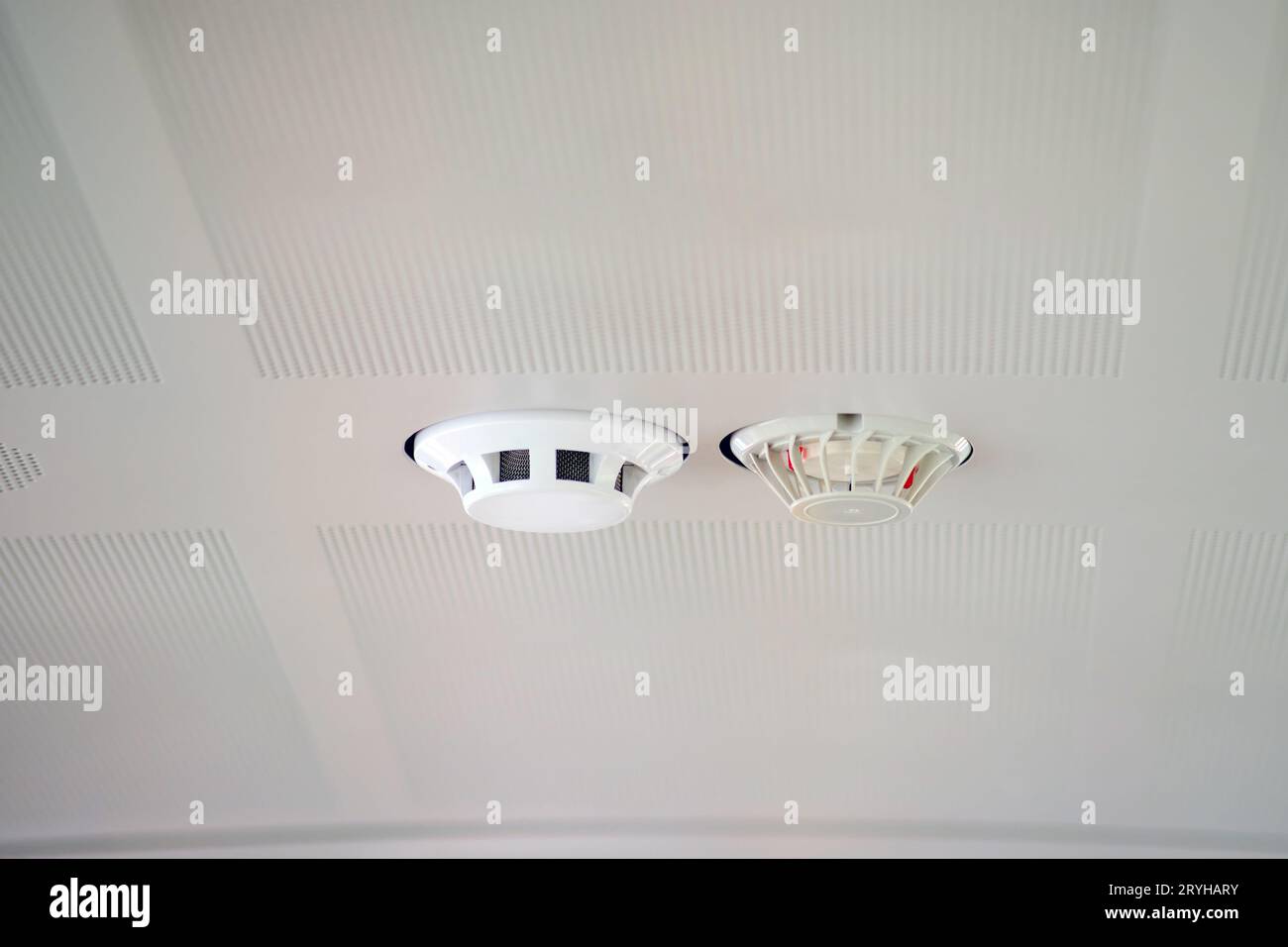 Fire alarm or fire sprinkler on ceiling in train, security concept ...