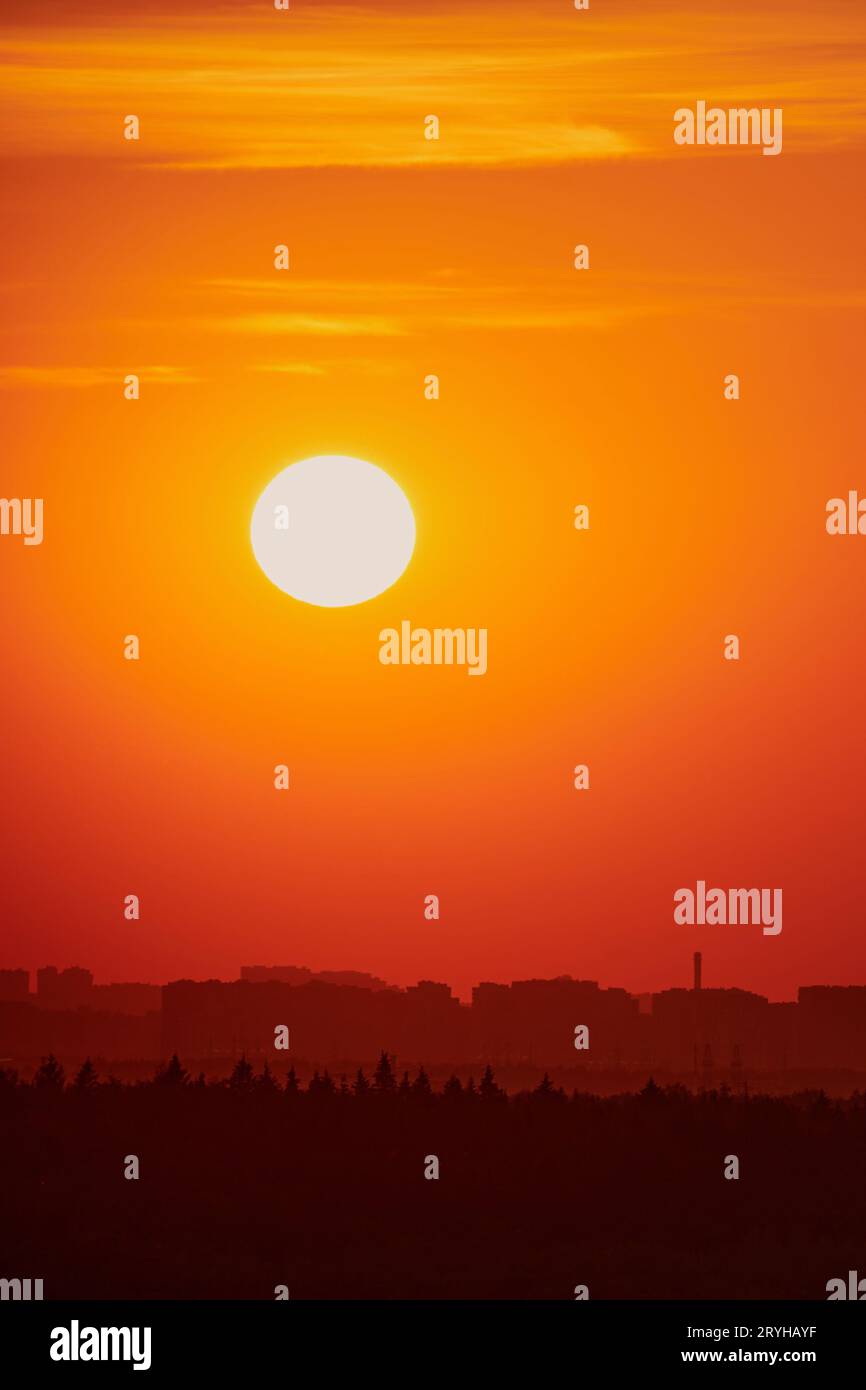 The warm glow of the rising sun on a clear dawn sky is a beautiful ...