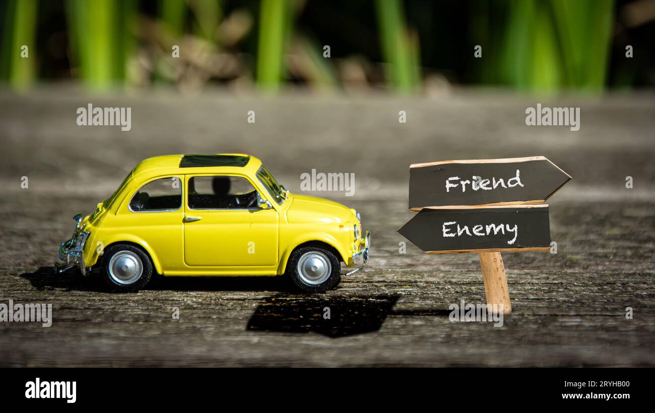 Street Sign to Friend versus Enemy Stock Photo - Alamy