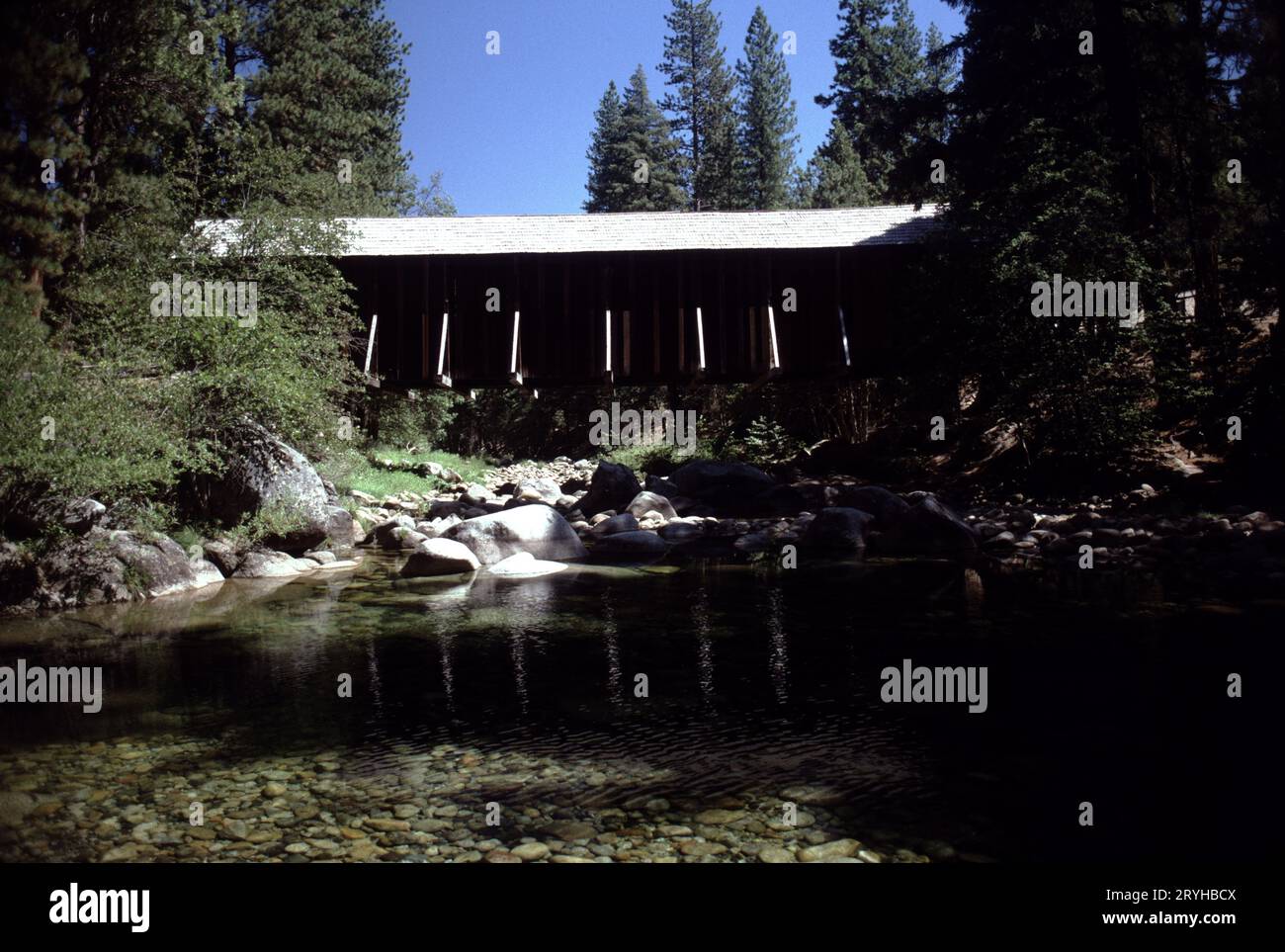 Yosemite National Park, CA. USA 5/1995. The Wawona Covered Bridge is a ...