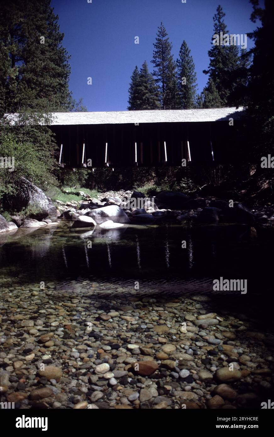 Yosemite National Park, CA. USA 5/1995. The Wawona Covered Bridge is a ...