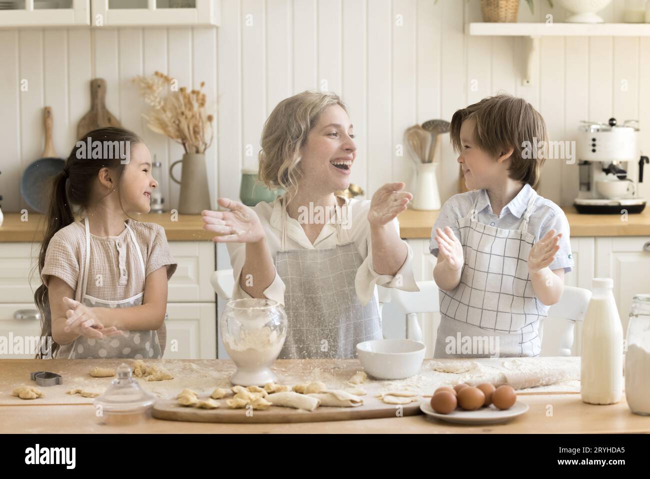 Loving mom have fun cooking homemade pastries with children Stock Photo ...