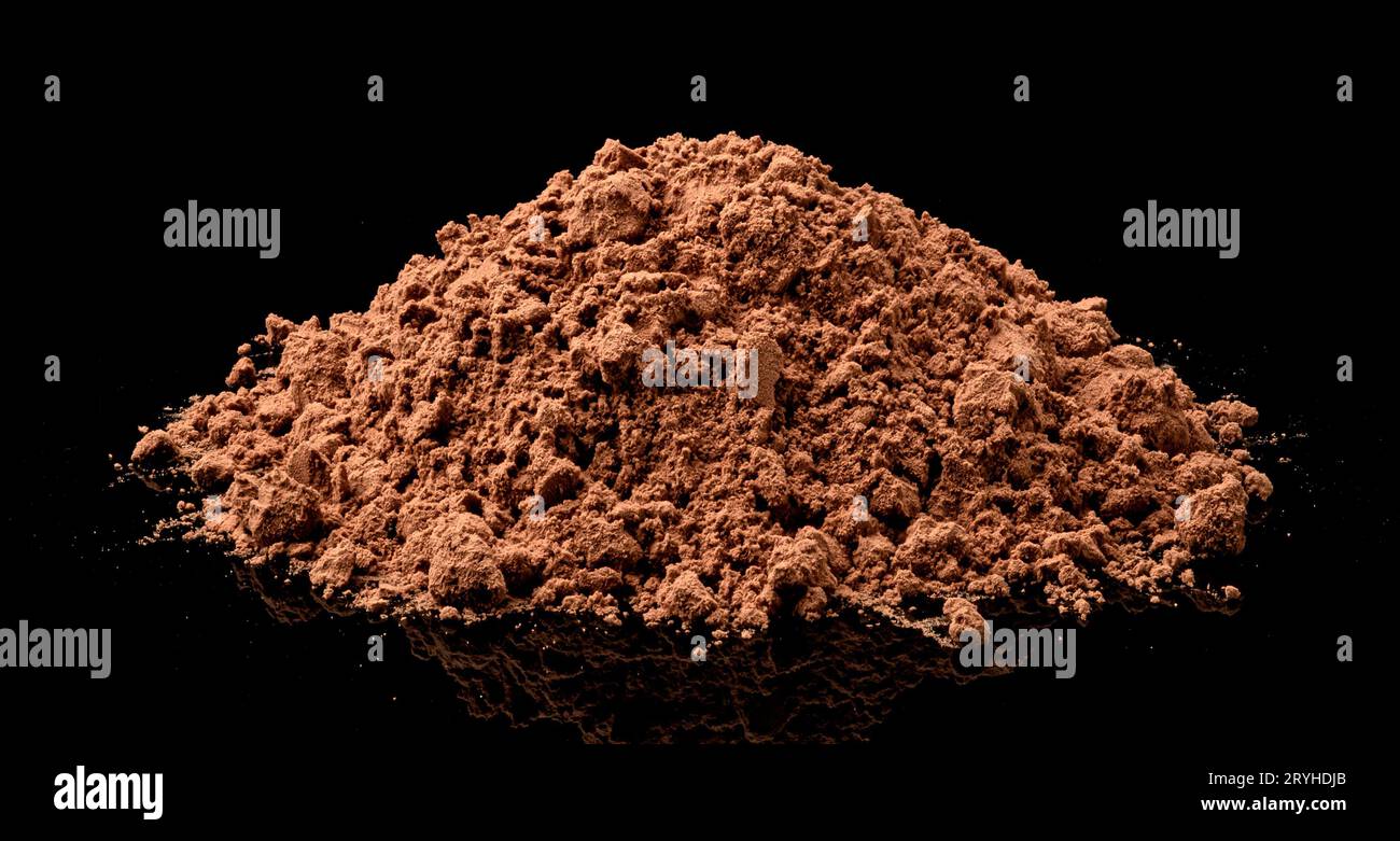 Pile of Cocoa powder isolated on black background Stock Photo - Alamy