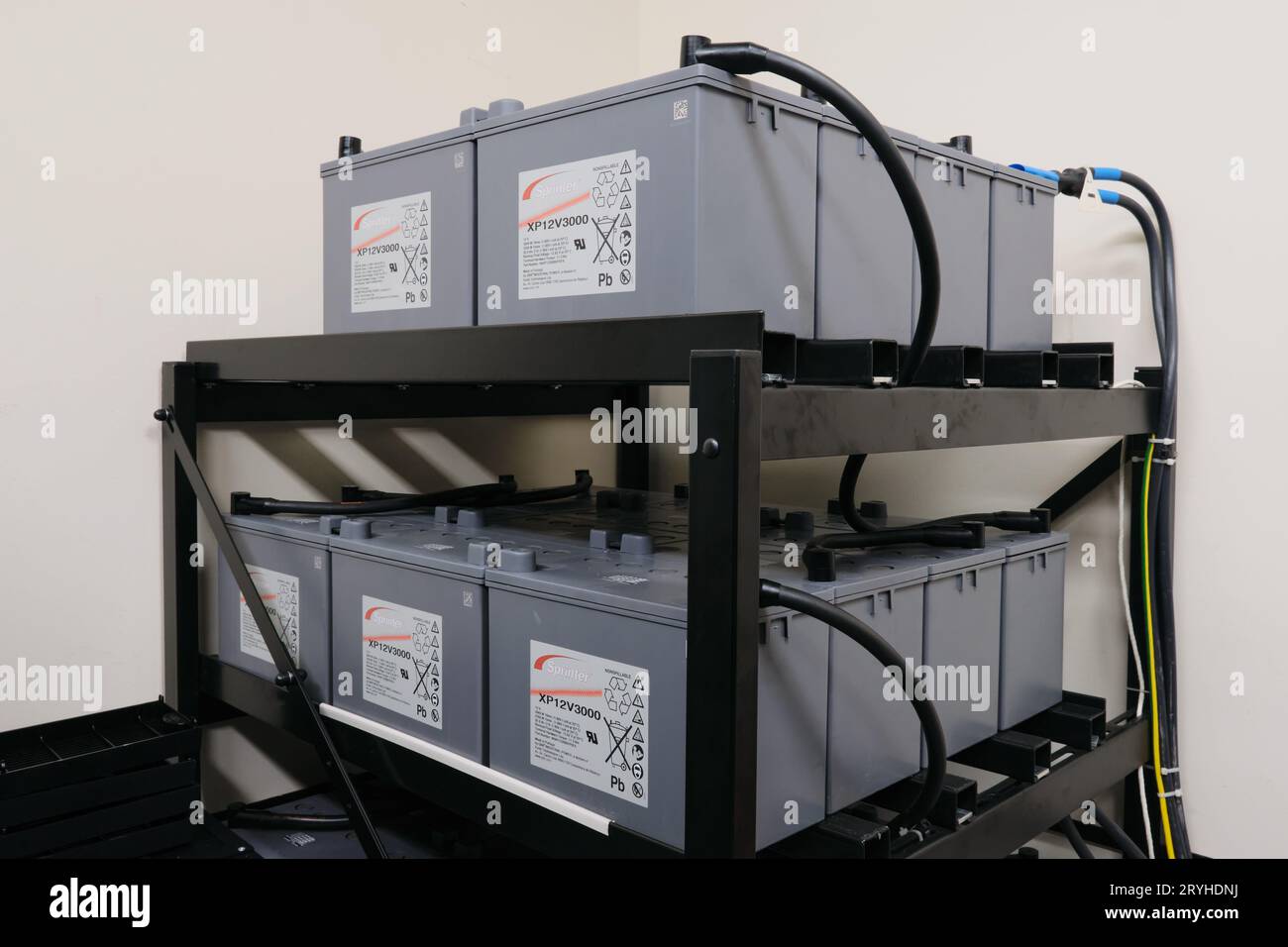 An industrial server room is equipped with a large UPS Sprinter backup battery system to ensure ...