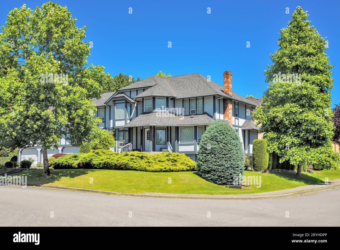 Big residential house on the street with brick chimney and steps on ...
