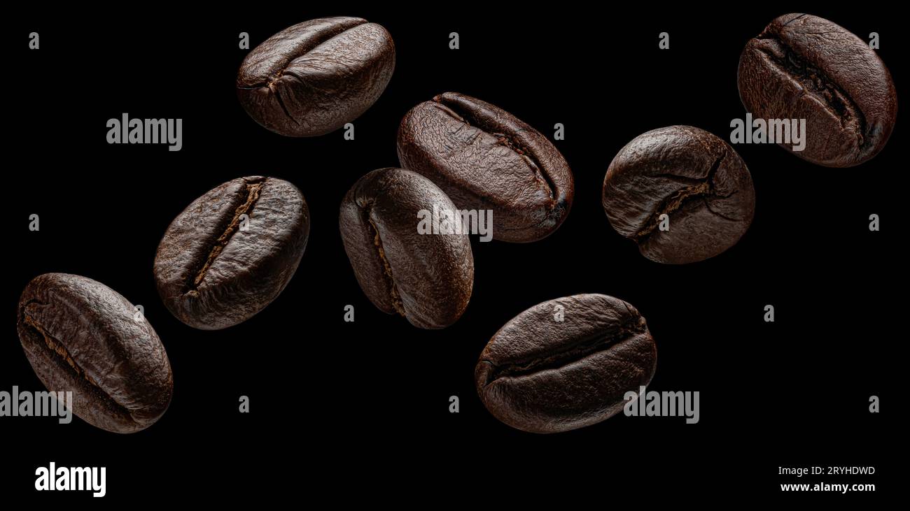 Falling coffee beans isolated on black background Stock Photo - Alamy