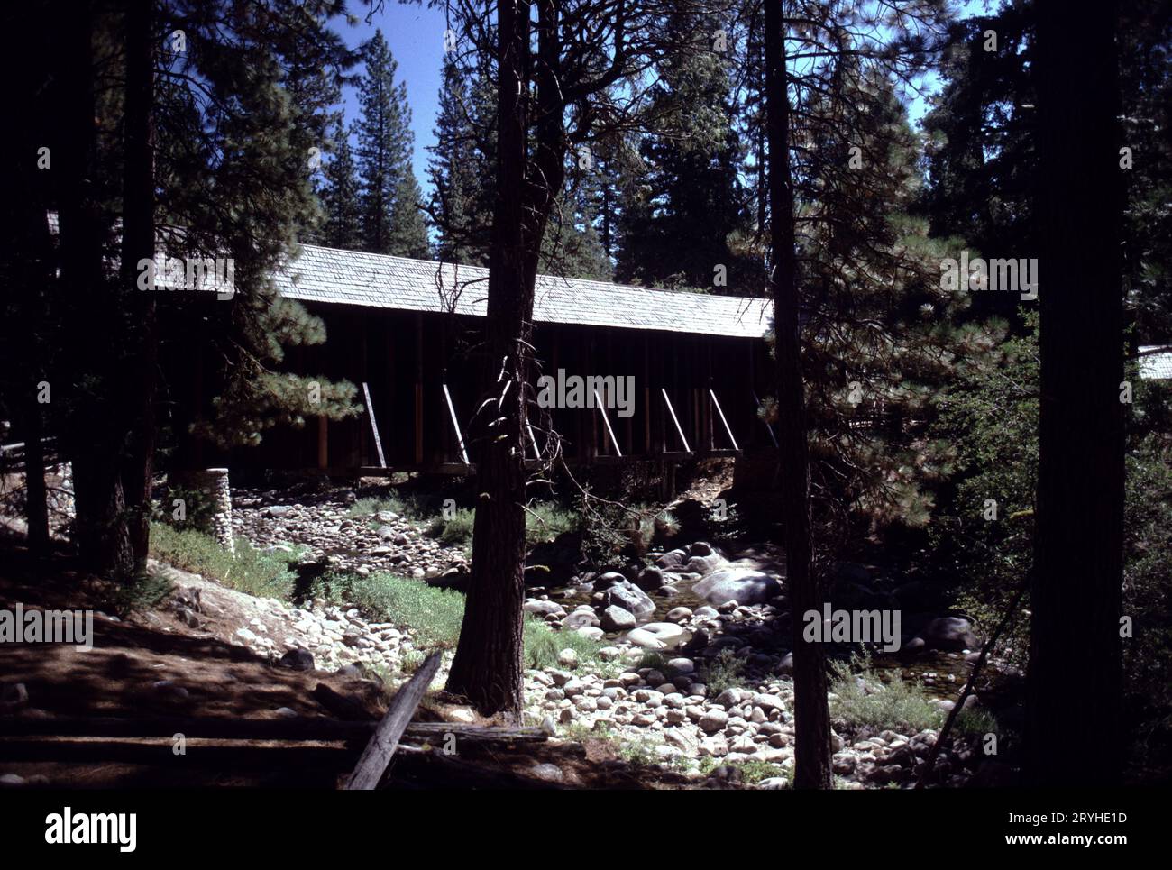 Yosemite National Park, CA. USA 5/1995. The Wawona Covered Bridge is a ...