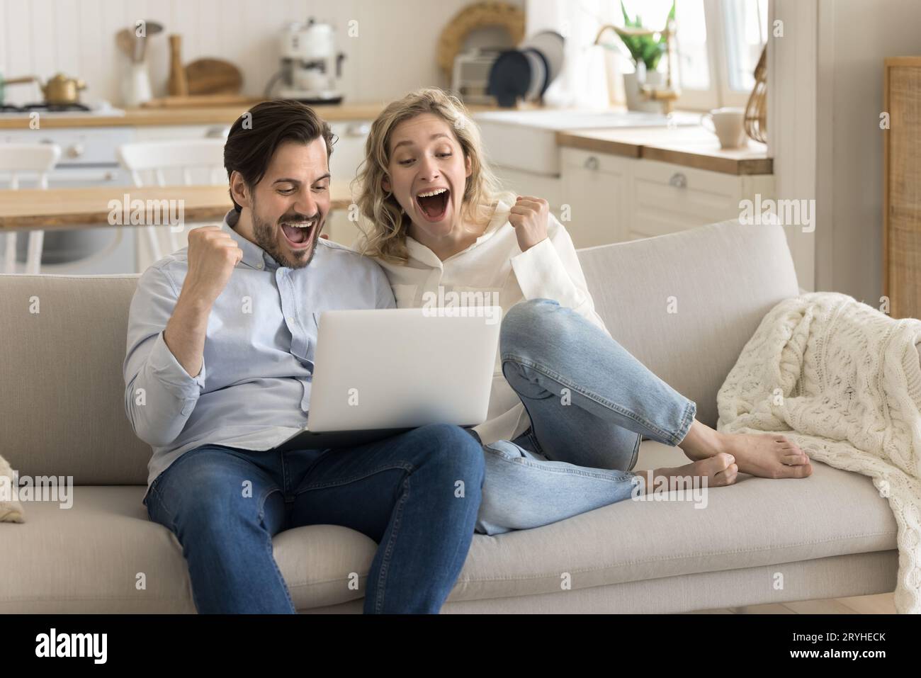 Overjoyed young couple celebrating on-line lottery win success Stock ...