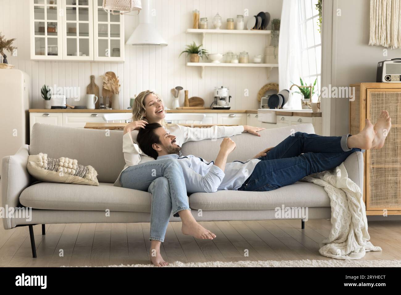 Beautiful loving married couple enjoy rest on couch Stock Photo - Alamy