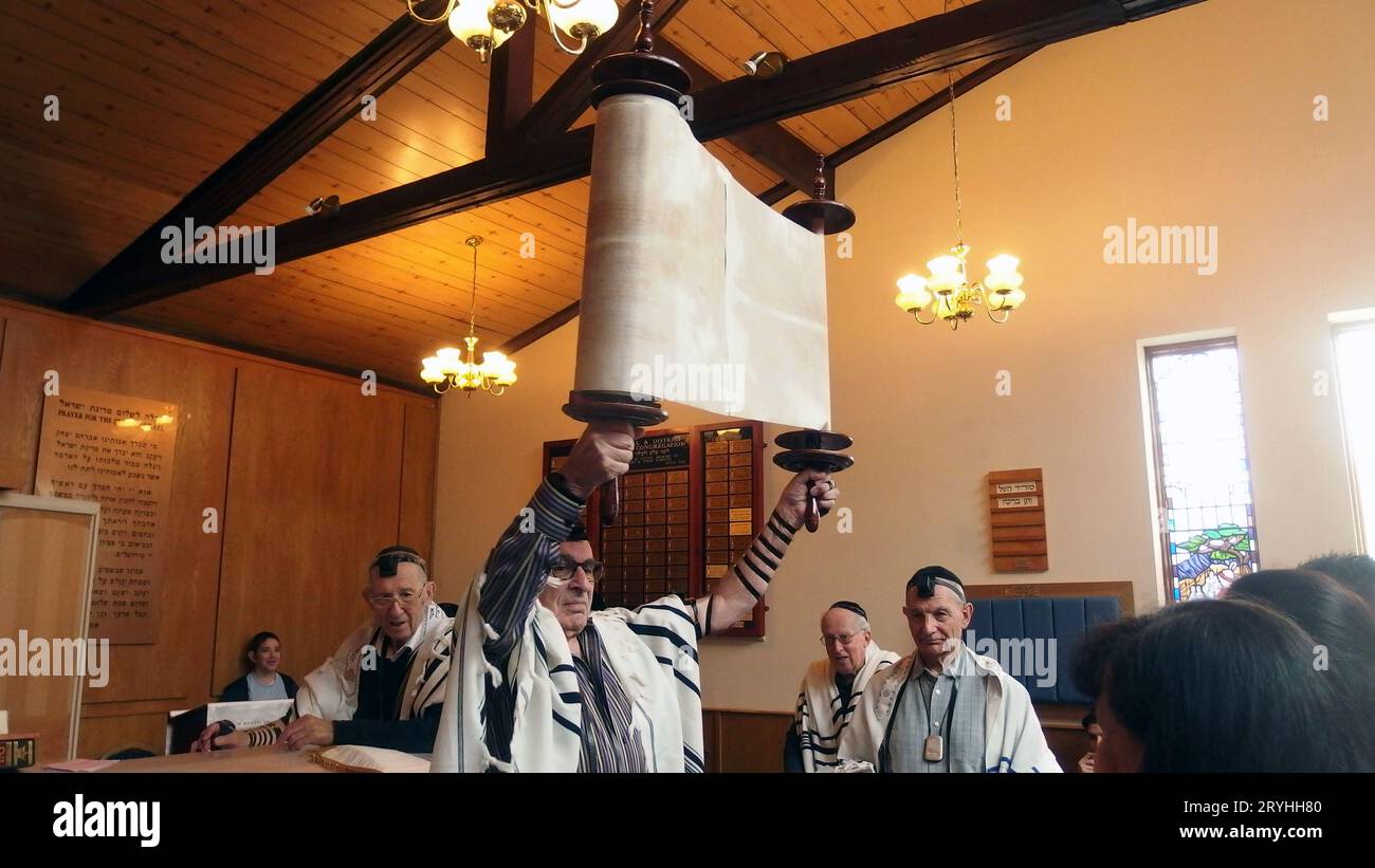 The Hagbahah (lifting of the Sefer Torah) ceremony when a congregant is ...