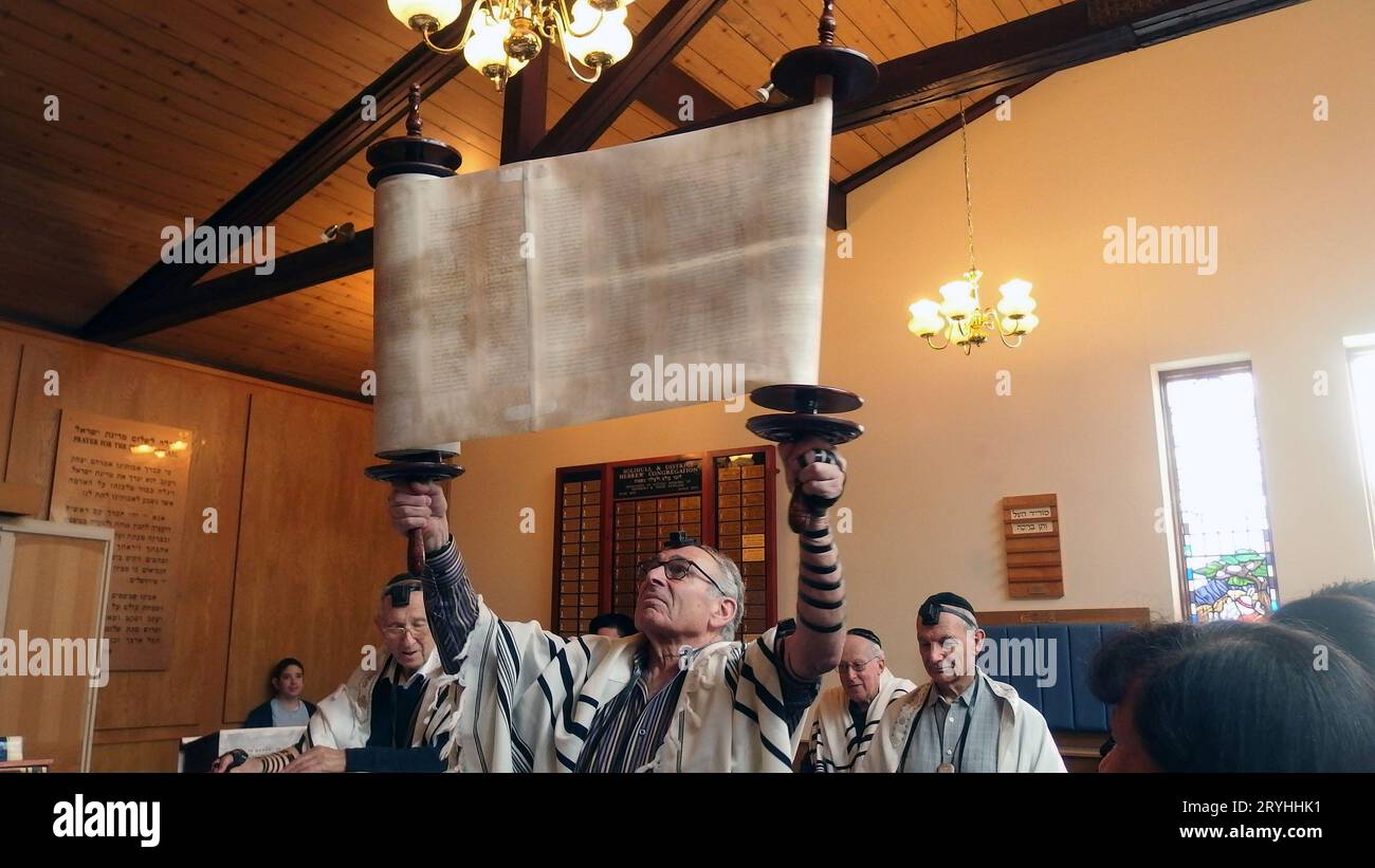 The Hagbahah (lifting of the Sefer Torah) ceremony when a congregant is ...