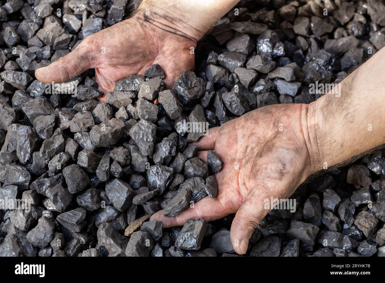 hands digging into coal, industrial mining concept, coal prices, energy cost for households and ...