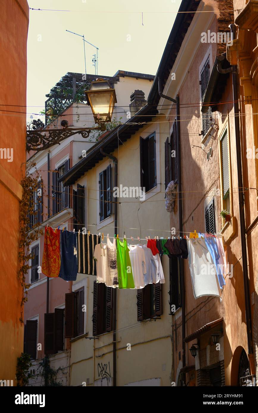 Traditional method to dry clothes hanging them on a line between two ...