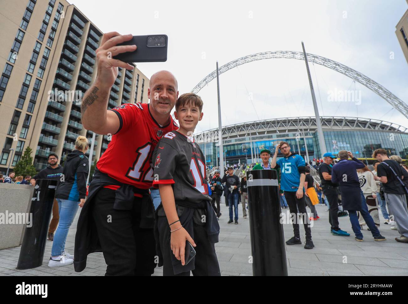 Fans take a selfie outside the stadium ahead of the NFL International ...