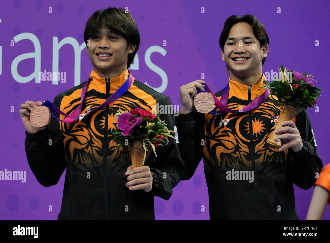 Bronze medalist Malaysia's Bertrand Rhodict Anak Lises and Enrique ...