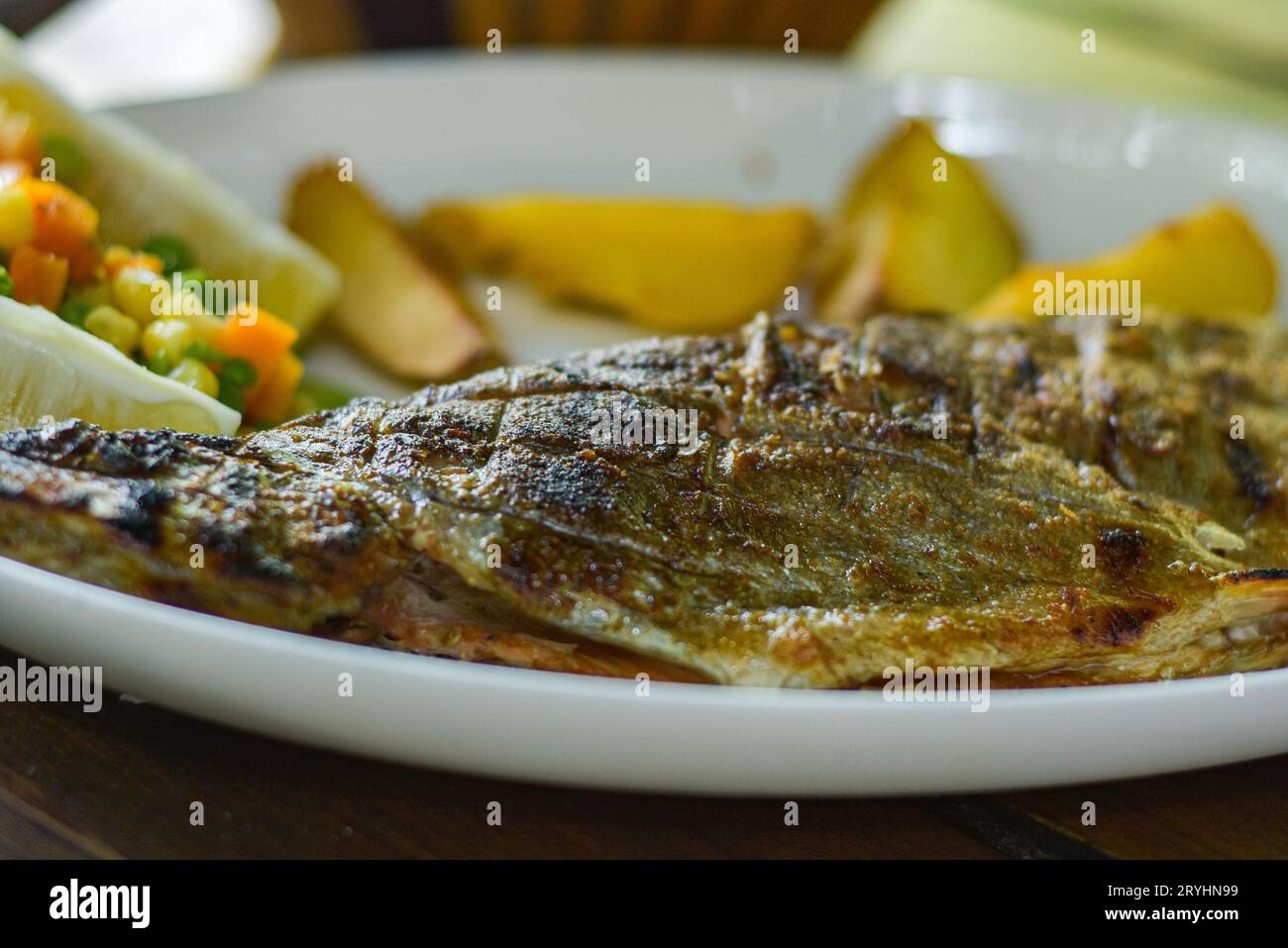 Fried Fish and potato in plate, Vinica Macedonia Stock Photo - Alamy