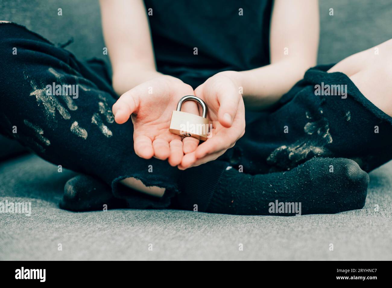 Symbolic image of basic child security, child poverty, child in torn ...