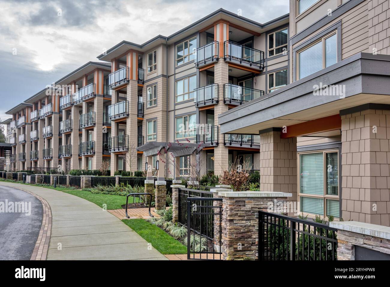 Residential apartment building with walking pathway in front Stock ...