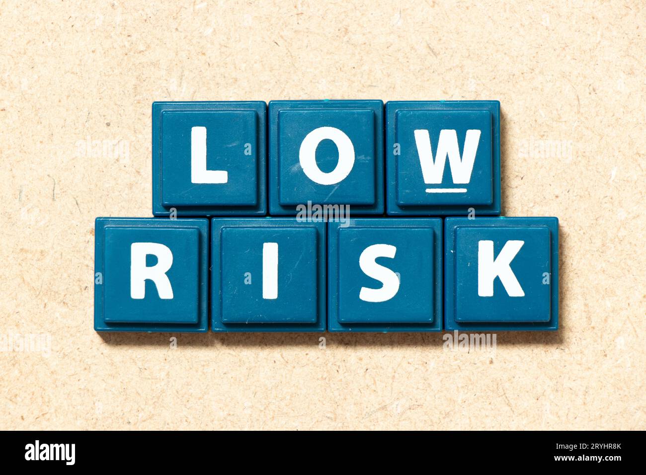 Tile alphabet letter in word low risk on wood background Stock Photo ...