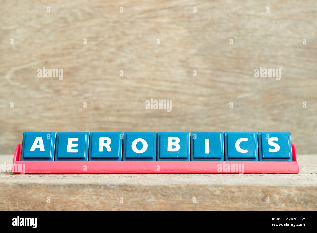 Tile alphabet letter with word aerobics in red color rack on wood ...