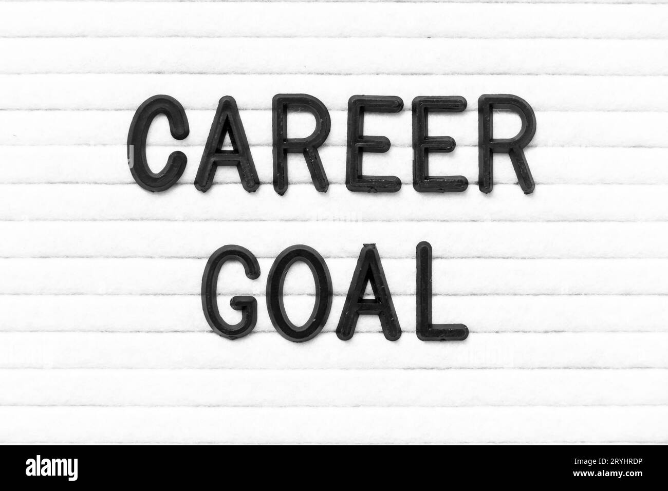 Black color letter in word career goal on white felt board background ...