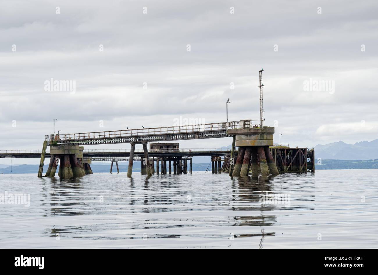 Old derelict wooden jetty pier in sea at Inverkip power station Stock ...