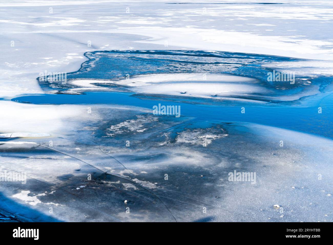 Lake with broken ice Stock Photo - Alamy
