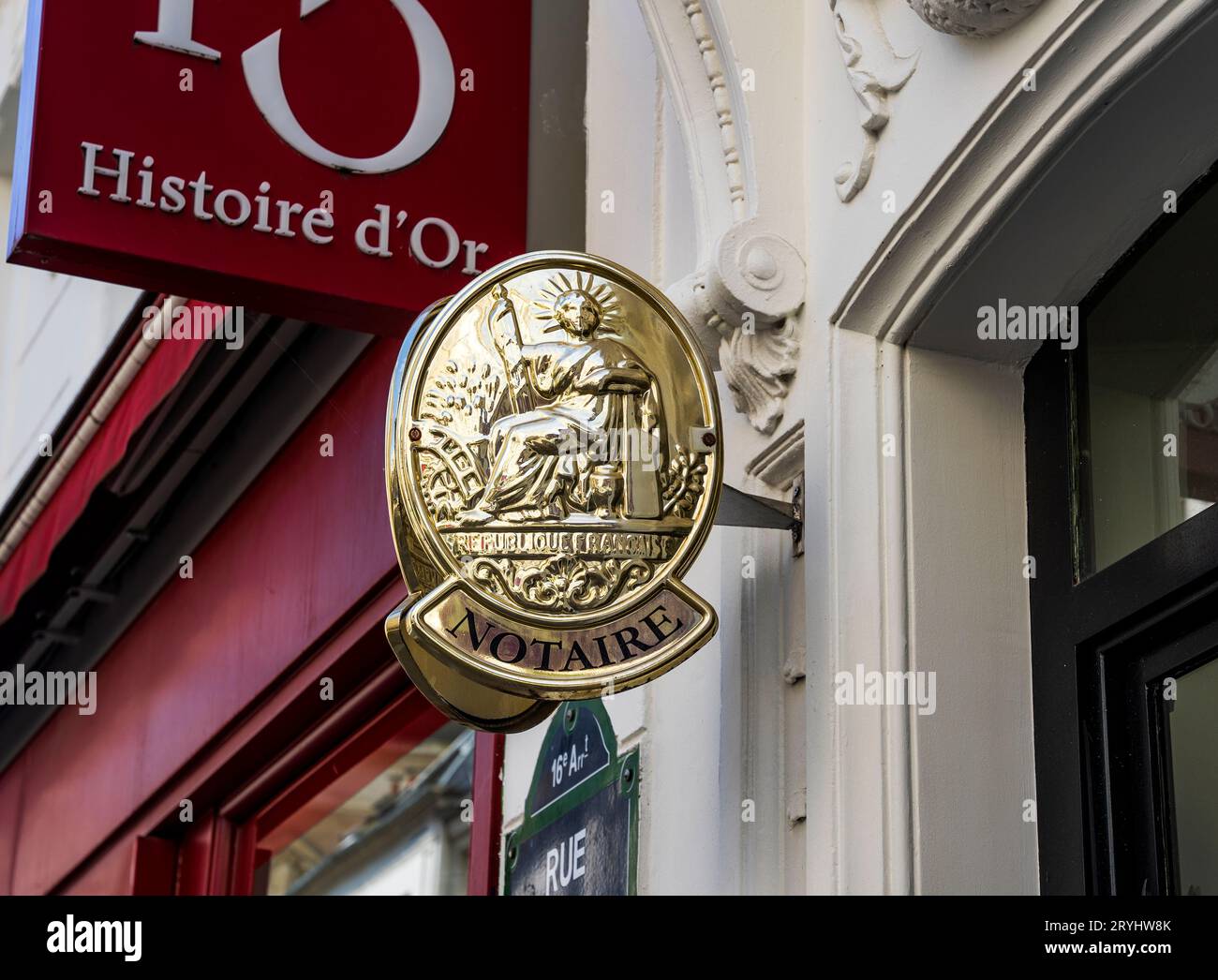 Typical metal plaque indicating a notary's office representing the ...