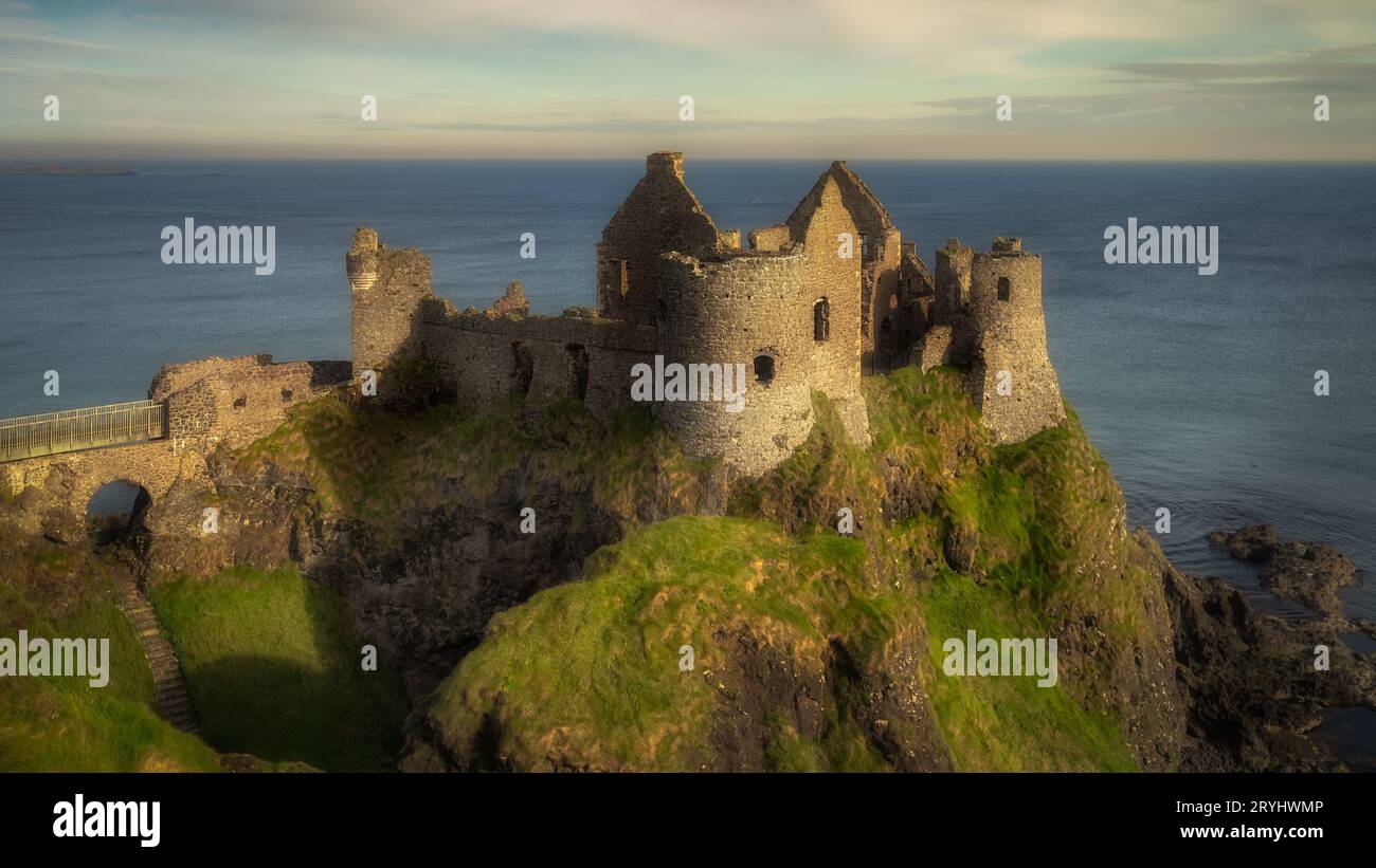 Ruins of Dunluce Castle located on the edge of cliff, Northern Ireland ...
