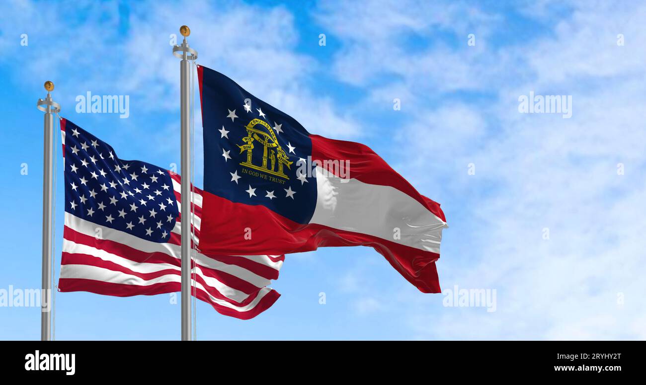The Georgia state flag waving along with the national flag of the US ...