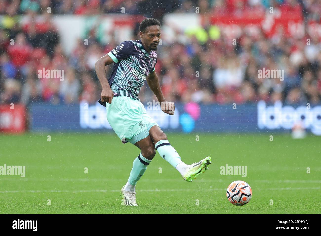 Ethan Pinnock #5 of Brentford passes the ball during the Premier League ...