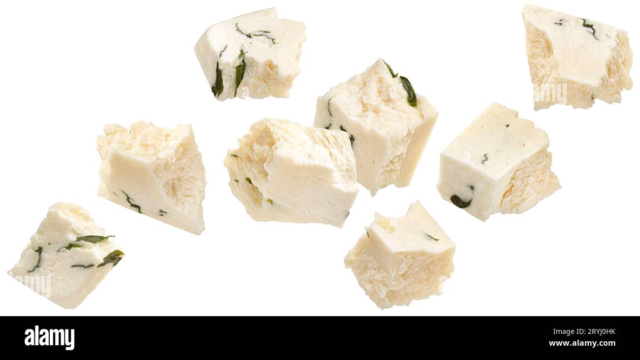 Falling feta pieces isolated on white background Stock Photo - Alamy