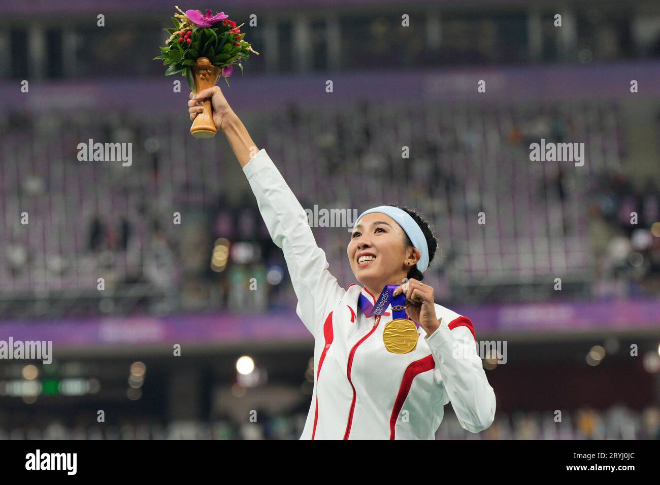 Gold medalist China's Lin Yuwei celebrates on the podium during the ...