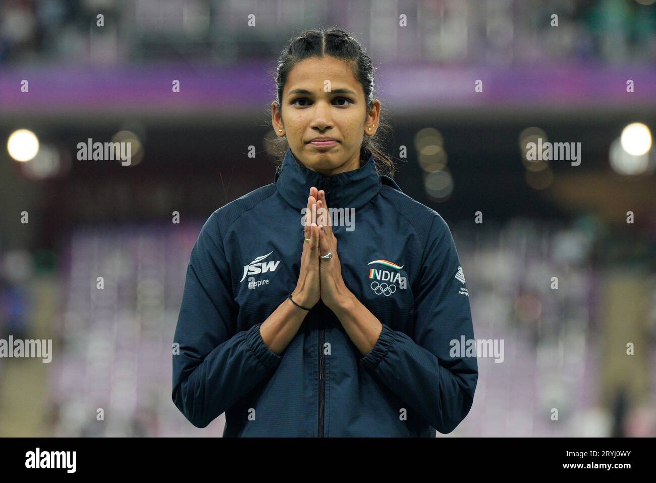 Silver medalist India's Jyothi Yarraji celebrates on the podium during ...