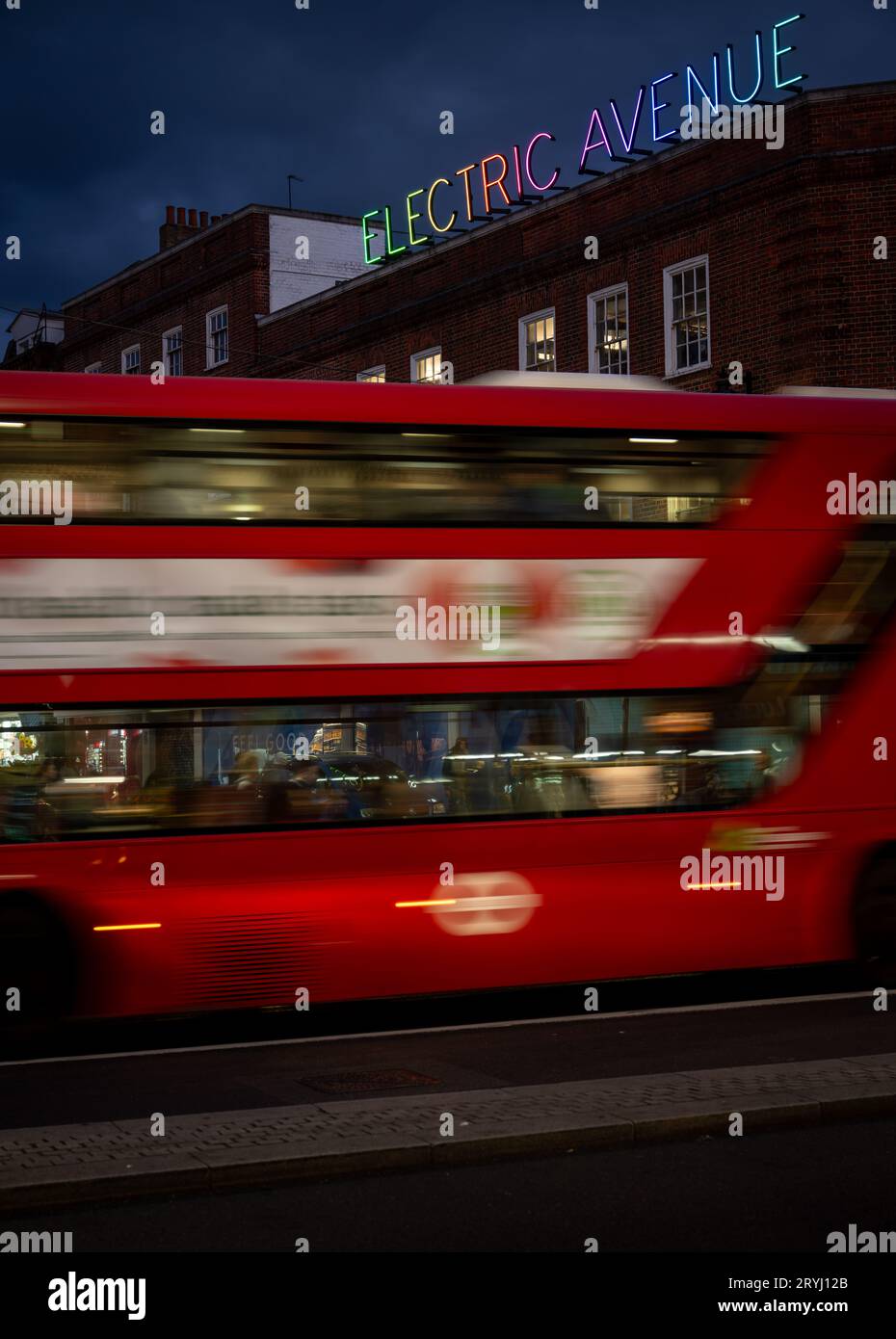 Brixton, London, UK: A red London bus with movement blur travelling ...