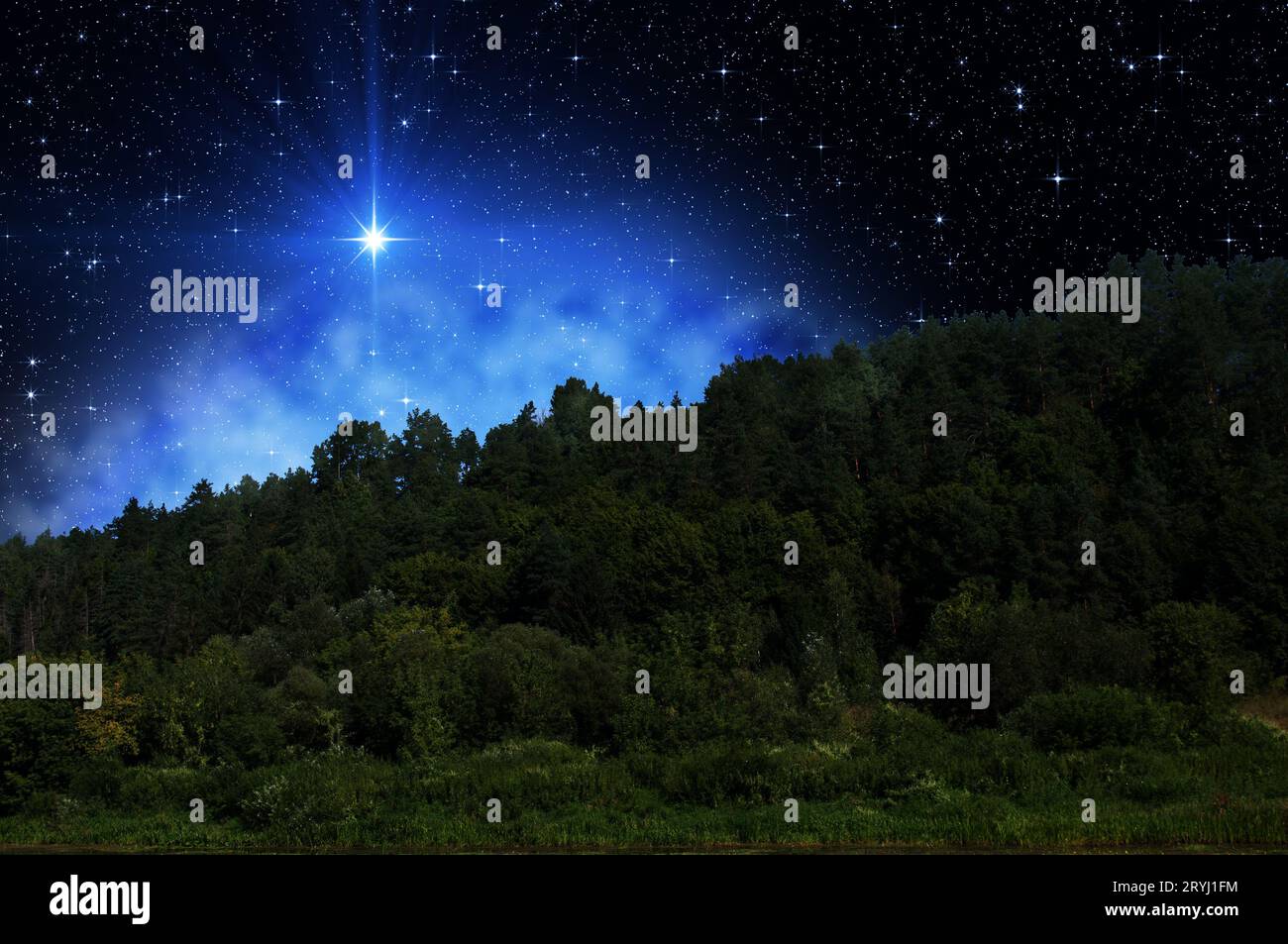 Birth of new star in the starry night sky beyond the mountains covered ...