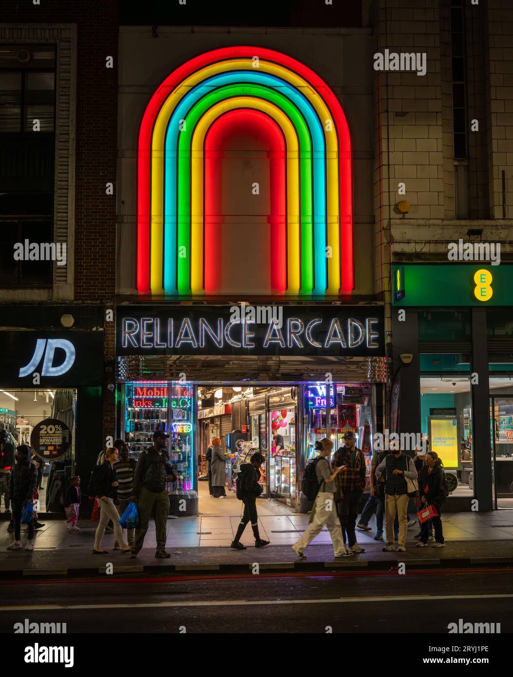 Brixton, London, UK: Entrance to Reliance Arcade at night. A shopping ...