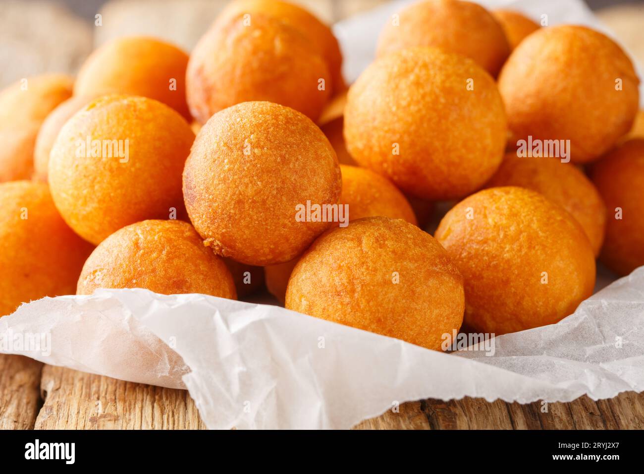 Fried sweet potato balls are a common Thai street sweet made ...