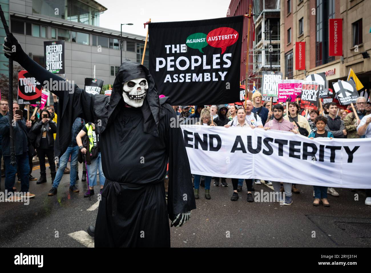 Manchester, UK. 01st Oct, 2023. A man dressed as skeleton leads the ...