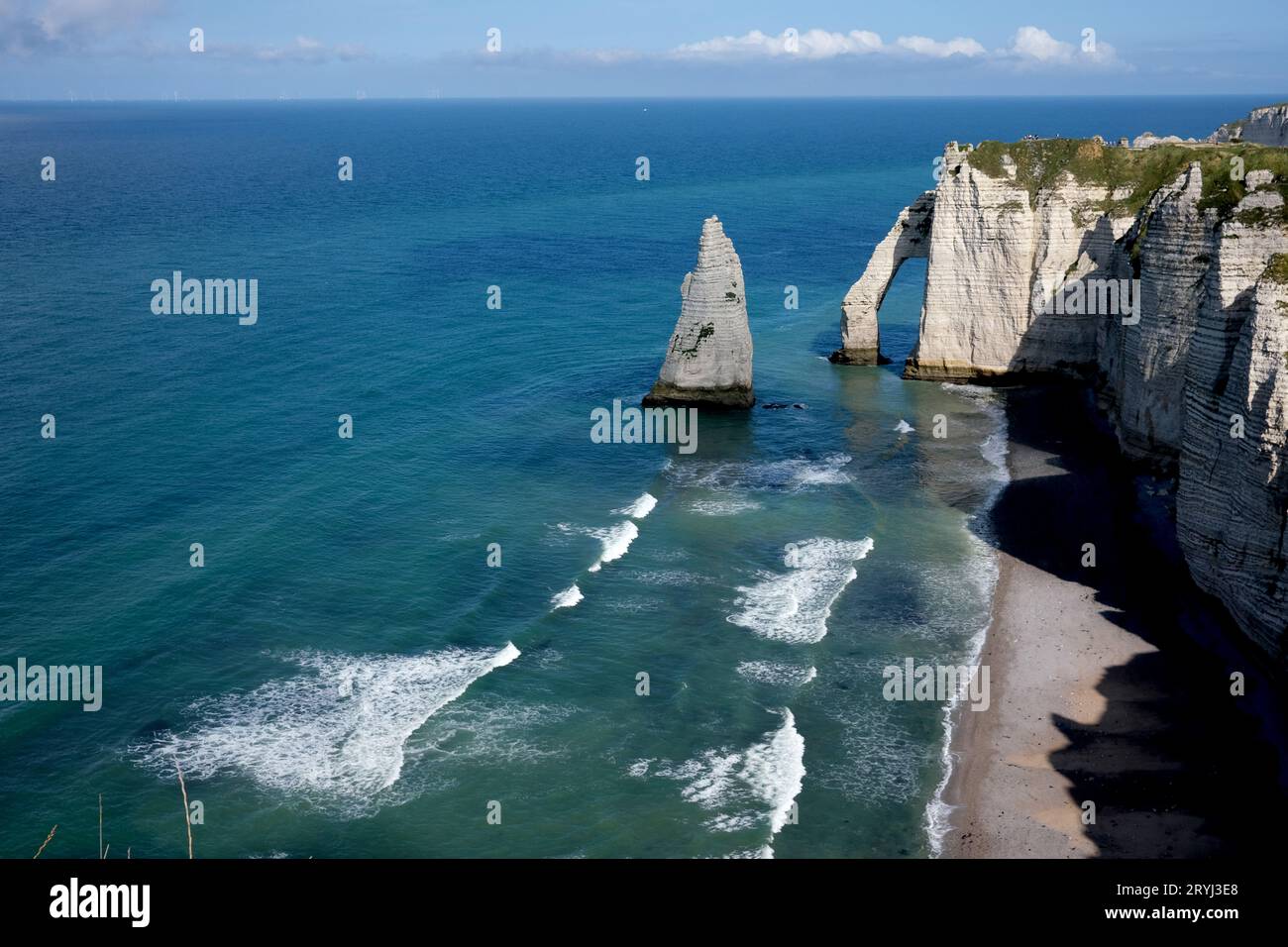 Etretat beach with it's famous chalk cliffs and coastal rock formations ...