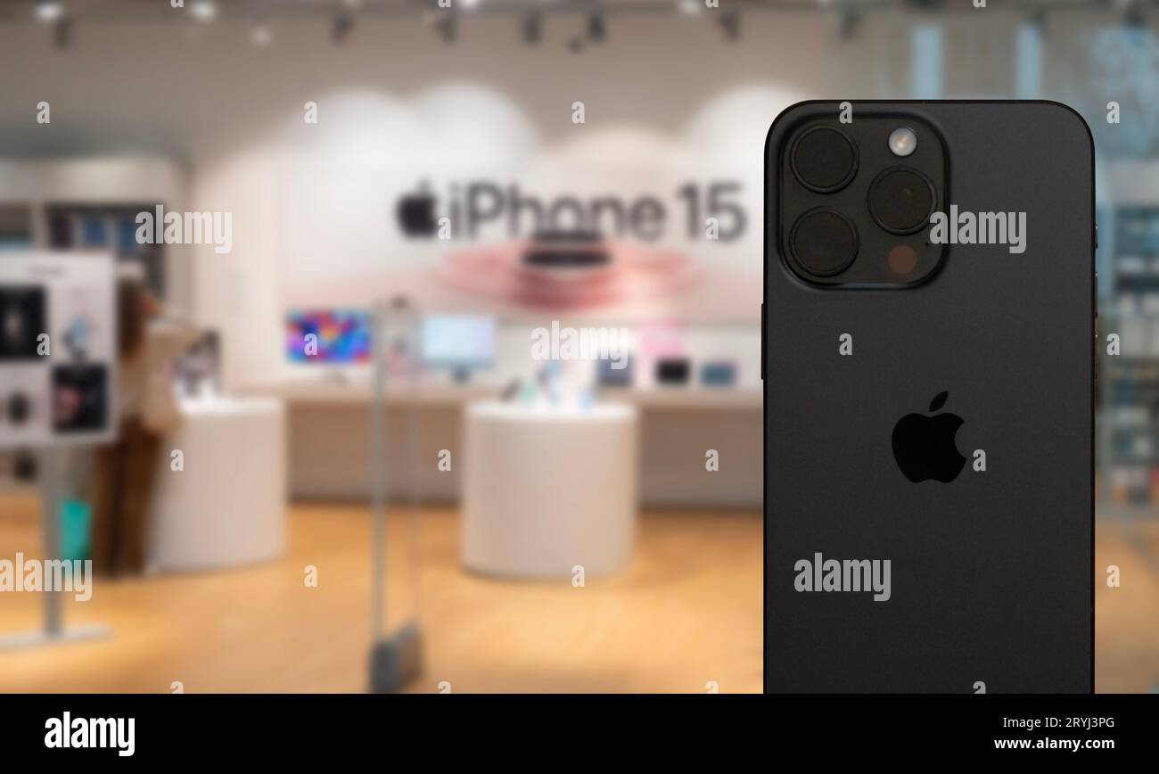 iPhone 15 back side on display in a store selling Apple products ...
