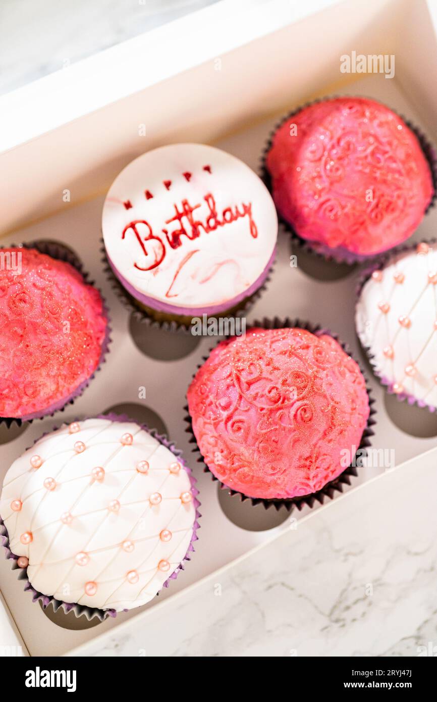 Creating Extravagant Cupcakes for Birthday Celebration Stock Photo - Alamy
